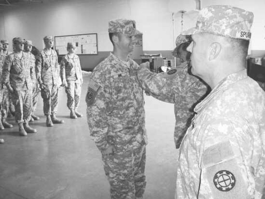 John receives Meritorious Service Medal