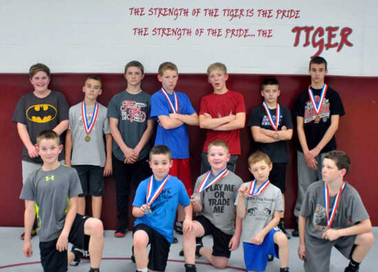 District dominance: Tiger Pit wrestlers collect 14 medals