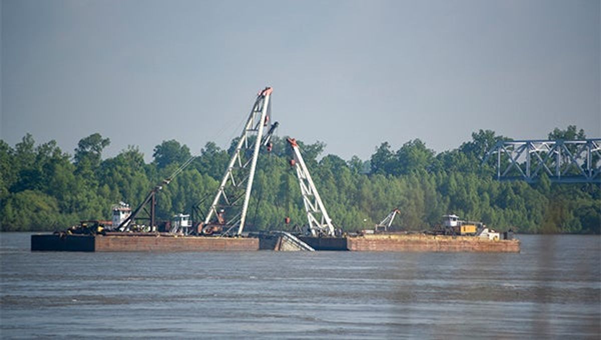 Barge that sank Thursday partially raised