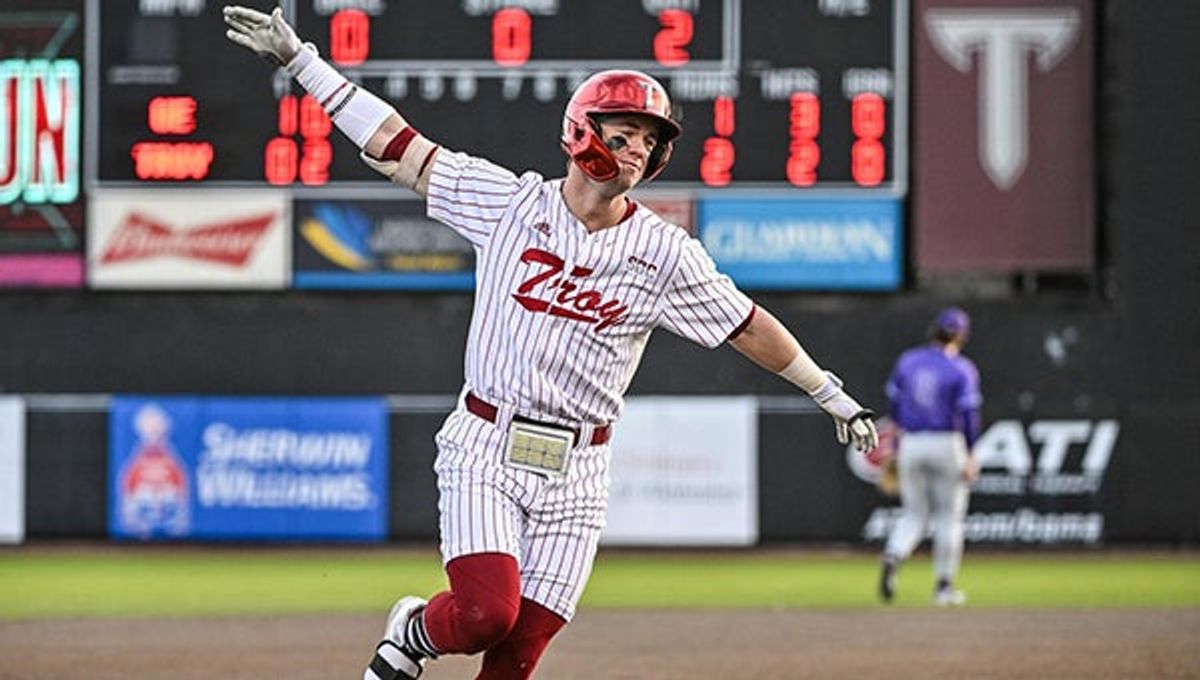 Lewis announces he'll return to Troy for another season