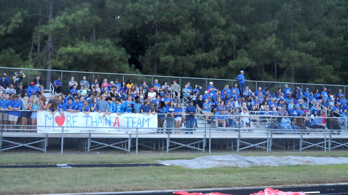 Lucas remembered, honored with blue apparel at game